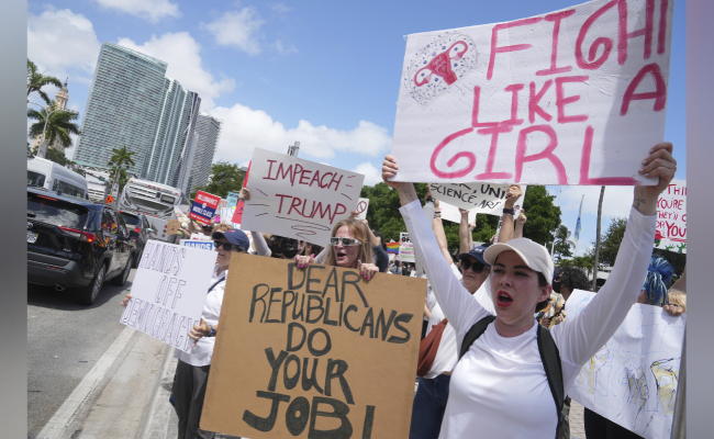 Angry protesters from New York to Alaska assail Trump and Musk in ...